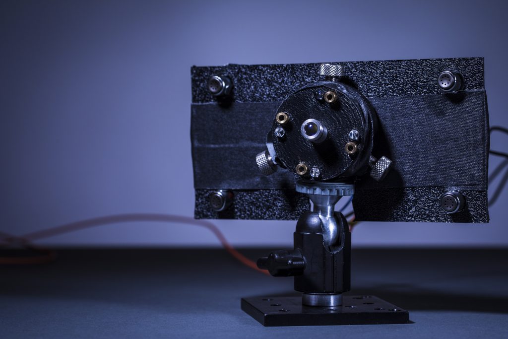Using a laser to wirelessly charge a smartphone safely across a room ...
